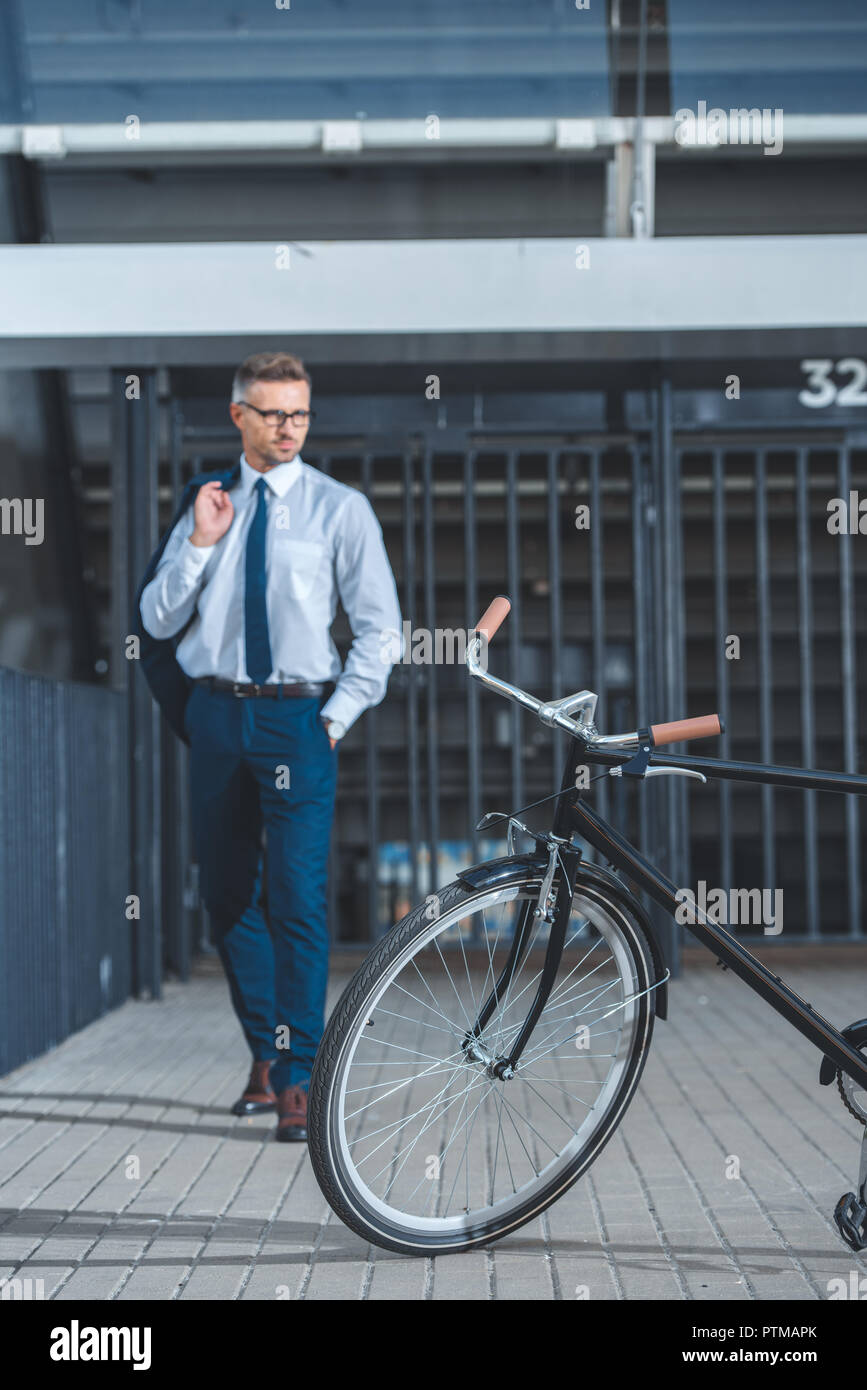 Male businessman standing bicycle hi-res stock photography and images ...
