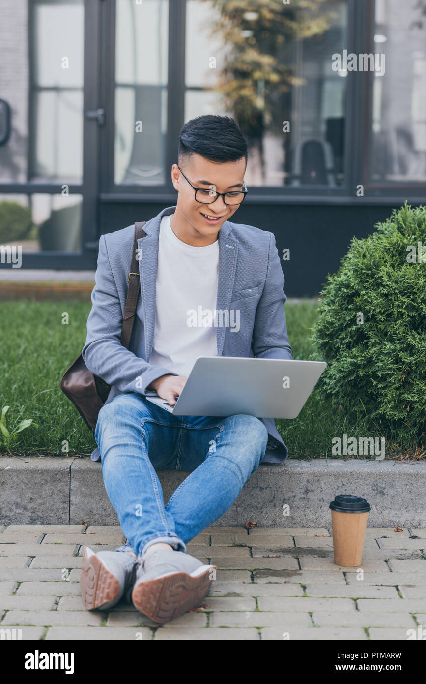 Smiling asian teleworker using hi-res stock photography and images - Alamy