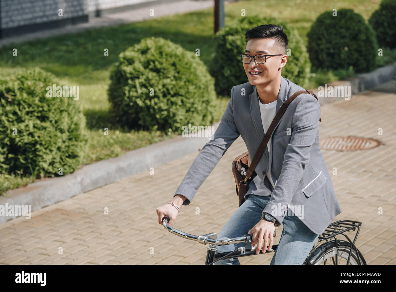 Asian man riding bicycle hi-res stock photography and images - Alamy