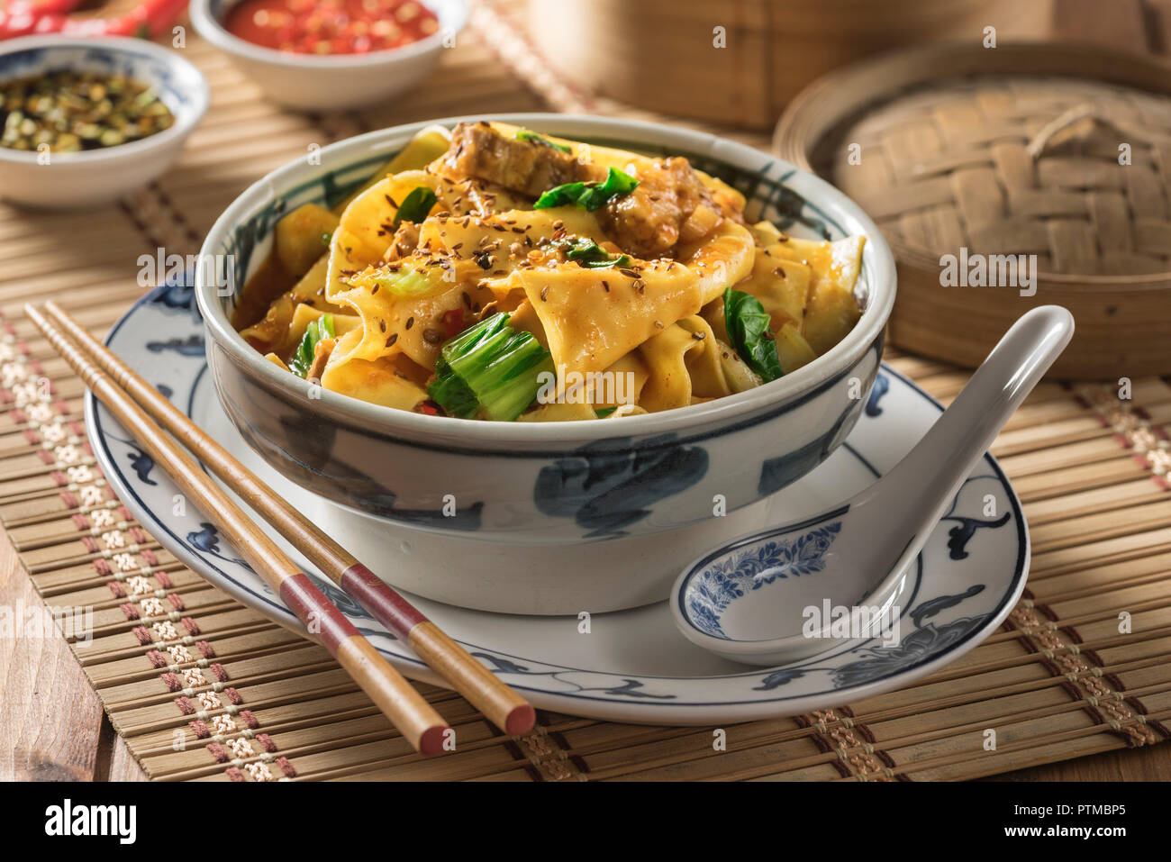 Biang biang noodles. Spicy regional Chinese food Stock Photo - Alamy