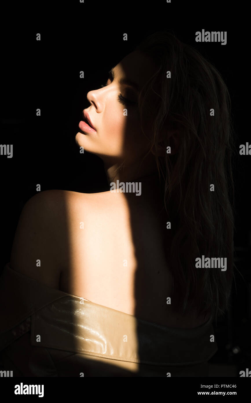 side view of beautiful and stylish model Stock Photo - Alamy