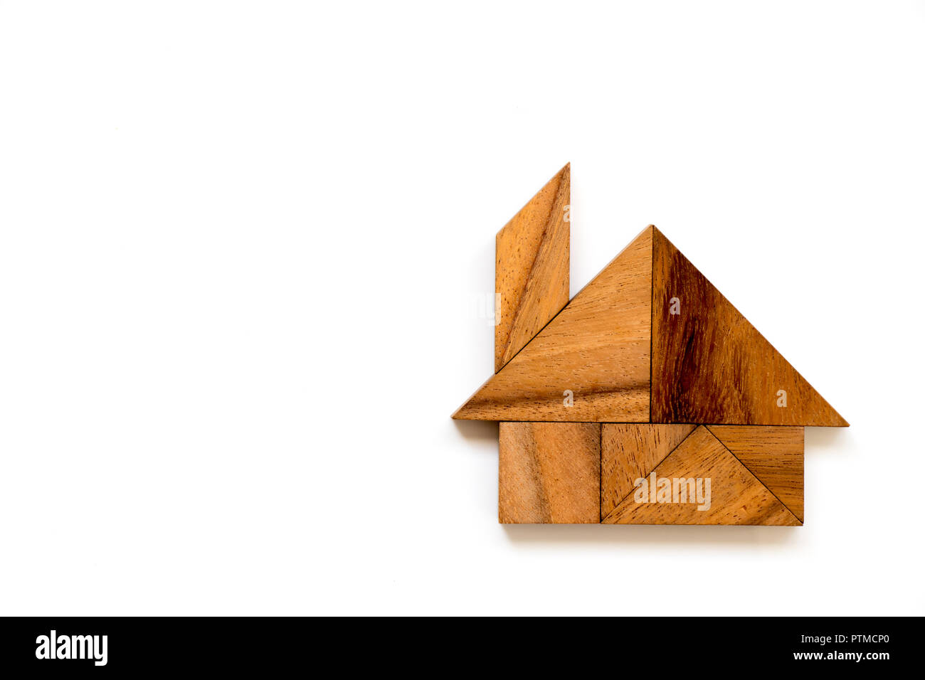Wood tangram puzzle in home or house shape on white background Stock ...