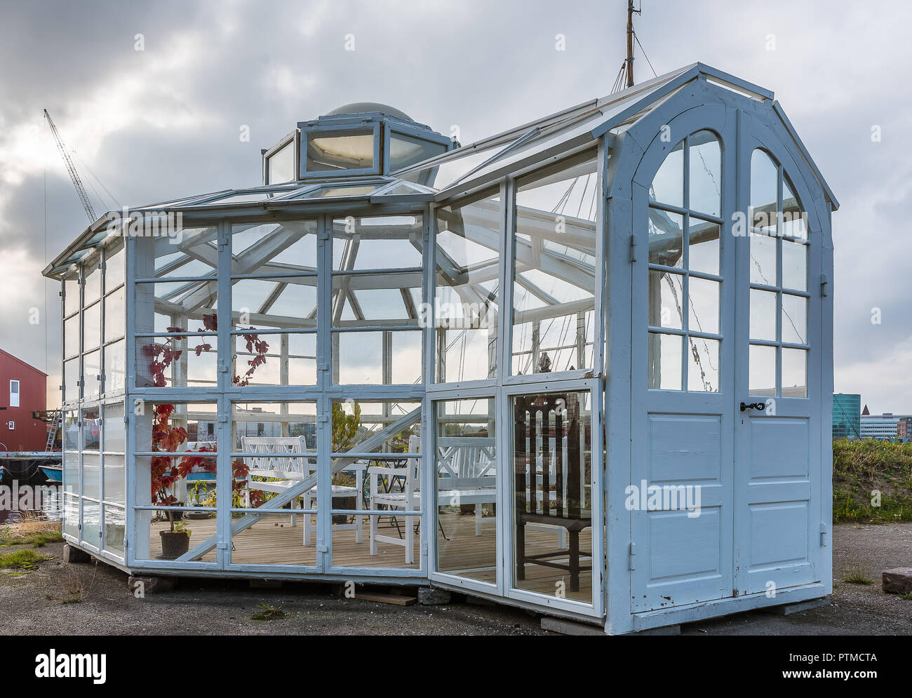 White glass-house decorated with flowers and white furnitue, Copenhagen ...