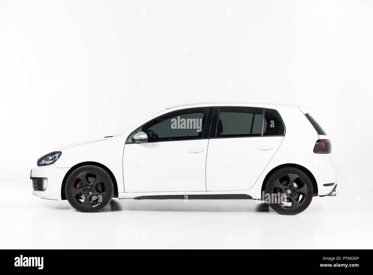 side view of one new white automobile on white Stock Photo - Alamy