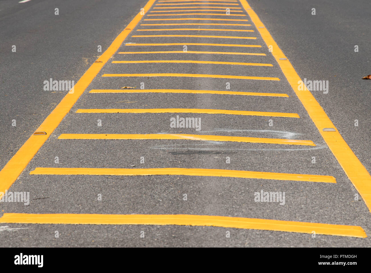Yellow color road line on asphalt background Stock Photo - Alamy