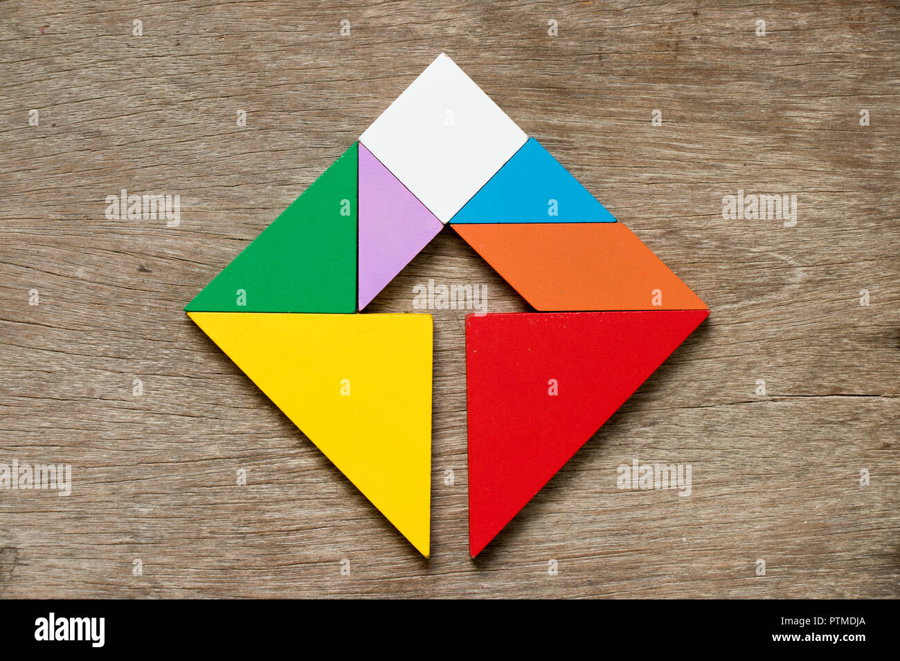 Colorful tangram puzzle in square with inside arrow direction shape on ...