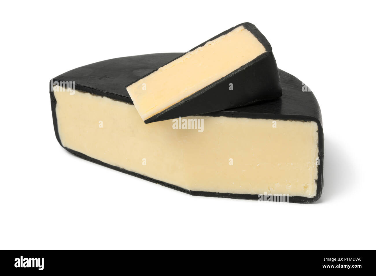 Piece of English waxed farmhouse cheddar cheese isolated on white ...