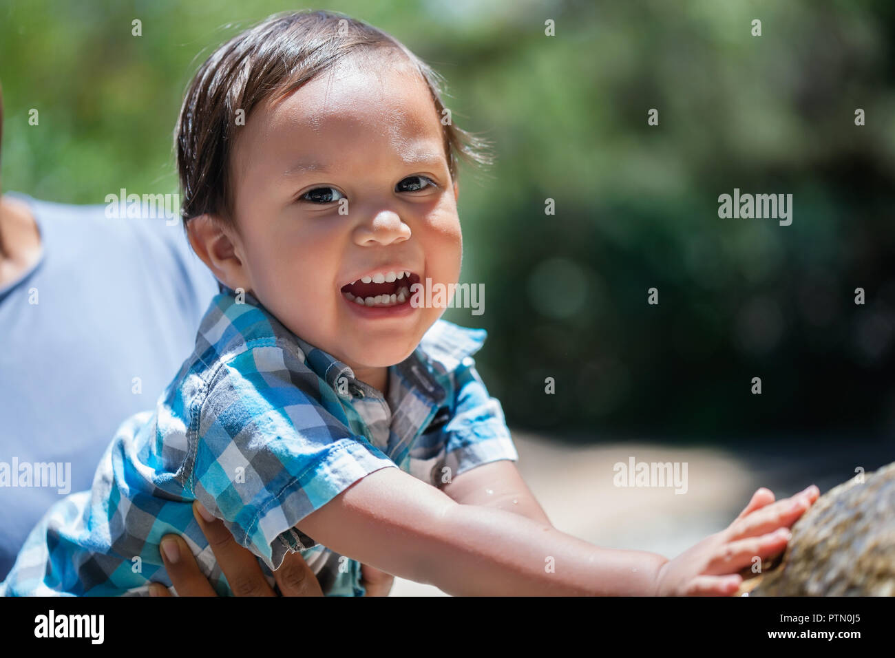Child touching water hi-res stock photography and images - Alamy