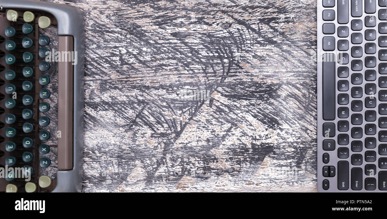 Old Typewriter and computer keyboard on a wooden table. Concept of ...