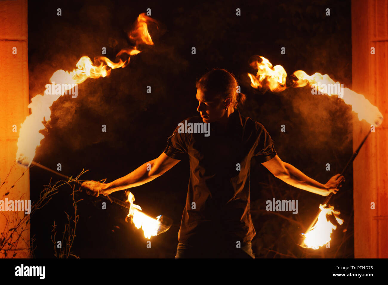 Fire show. Fakir dances with two Staff. Night performance Stock Photo ...