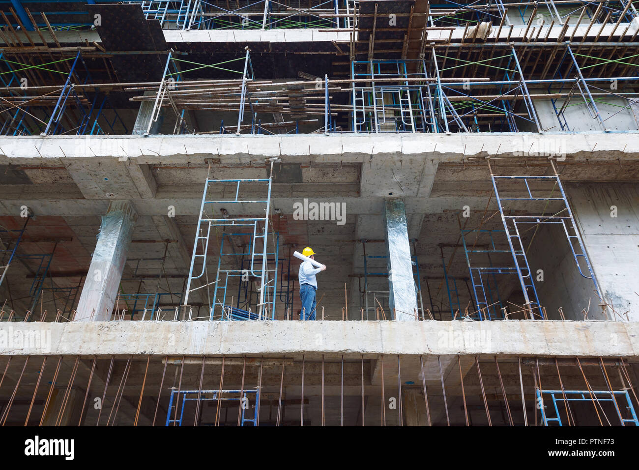 Construction concepts, Engineer and Architect working at Construction Site with blueprint Stock ...