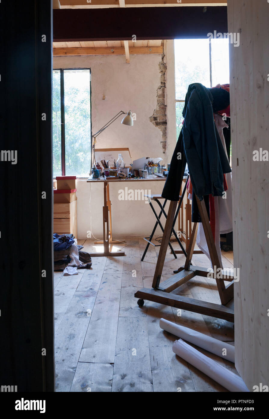 Messy studio of an artist, table with several objects Stock Photo - Alamy