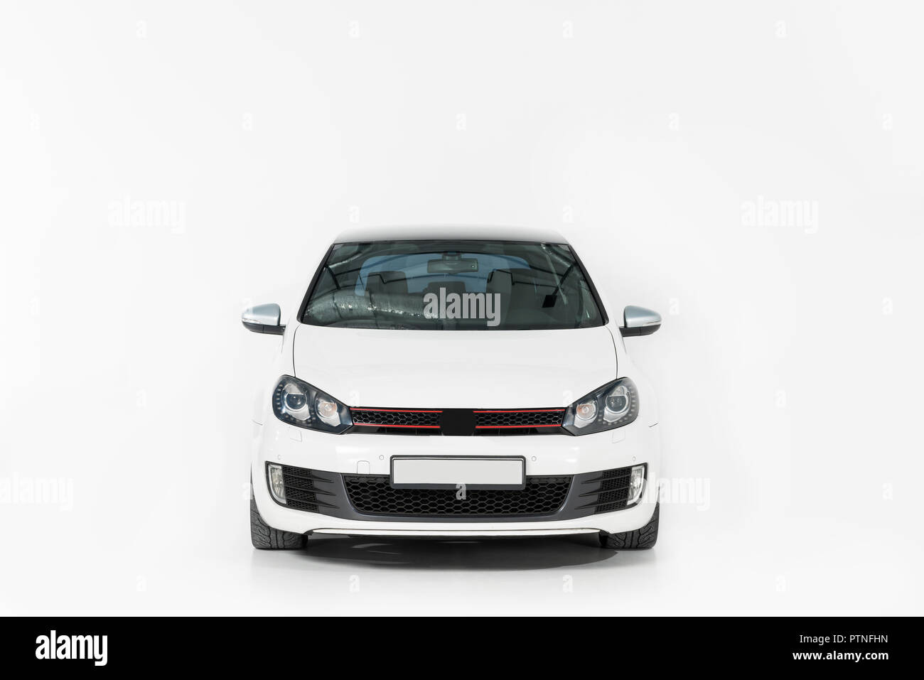 front view of one new white automobile on white Stock Photo - Alamy