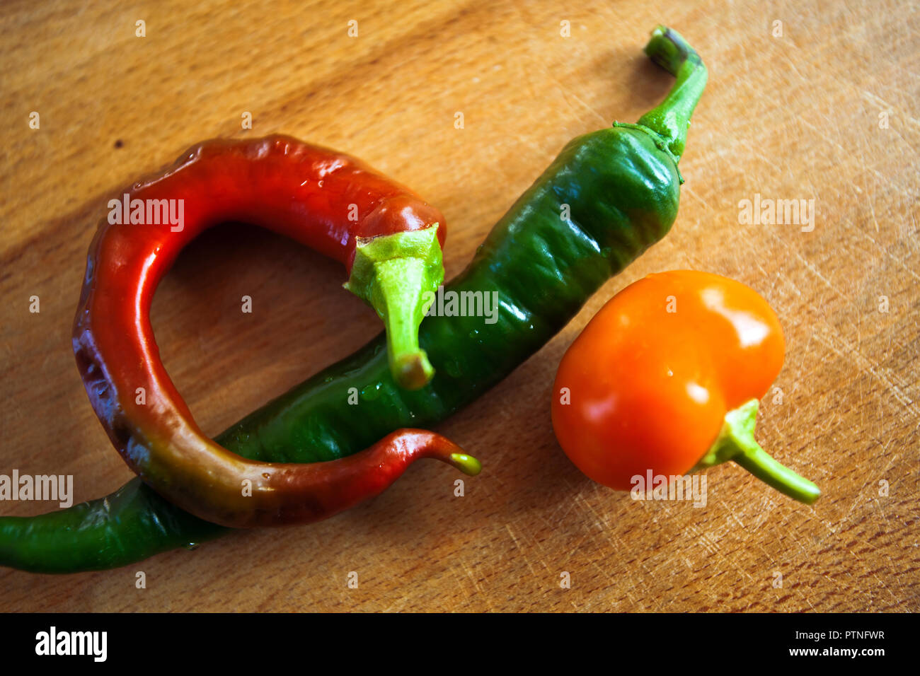 Fresh peppers of different shapes and colors Stock Photo - Alamy