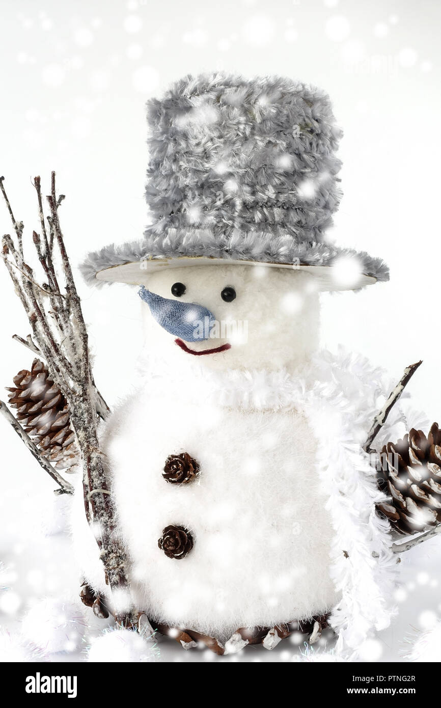 Closeup of a snowman with snowballs and snow on white background Stock ...