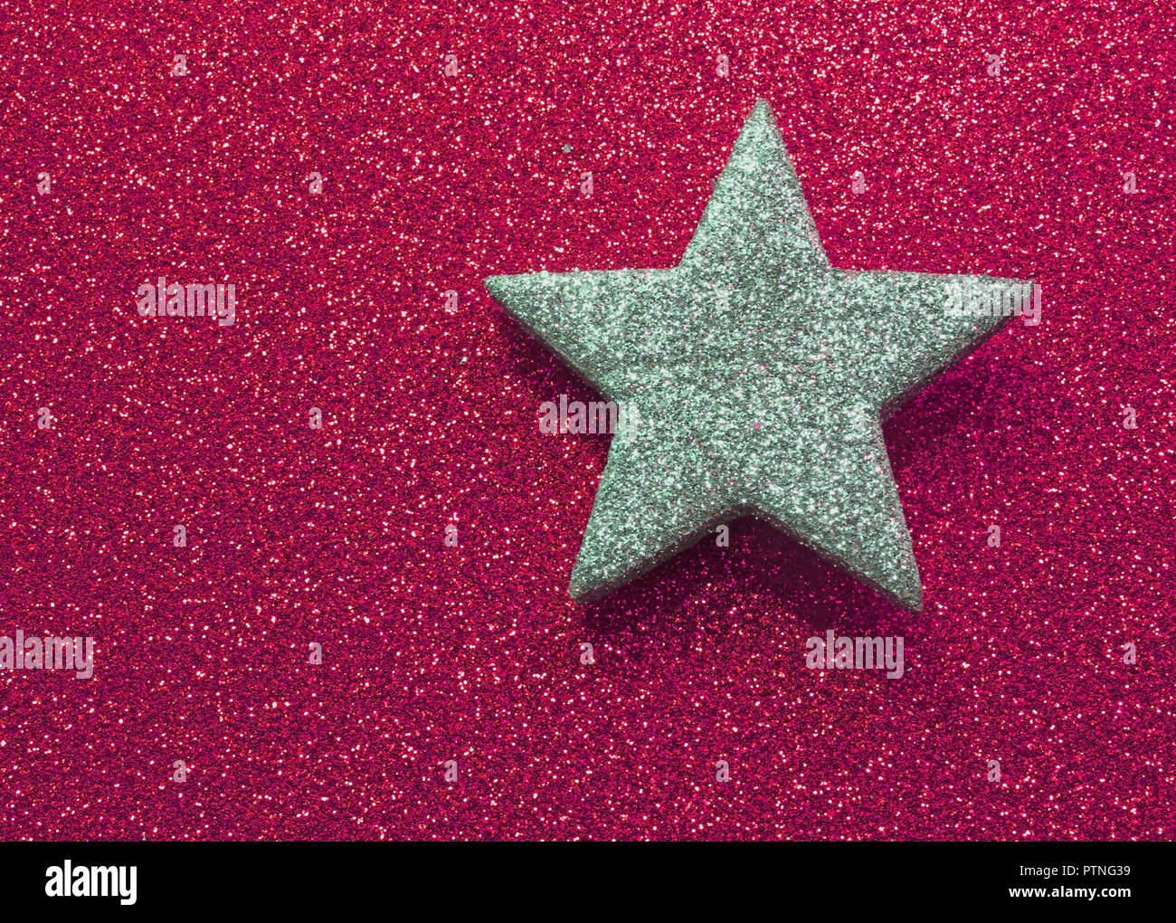 very large silver star in brilliant red background Stock Photo - Alamy