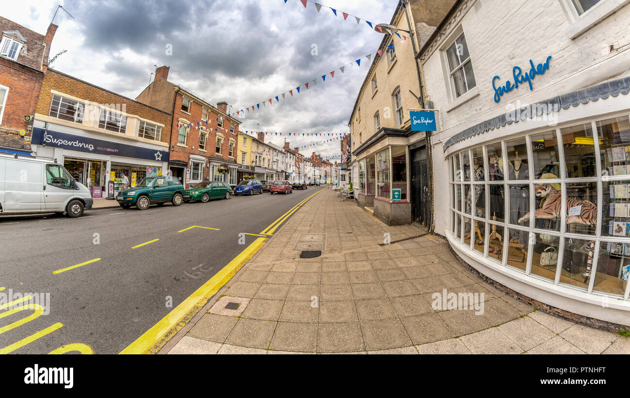 Street view of Alcester High Street looking towards St. Nicholas Church ...