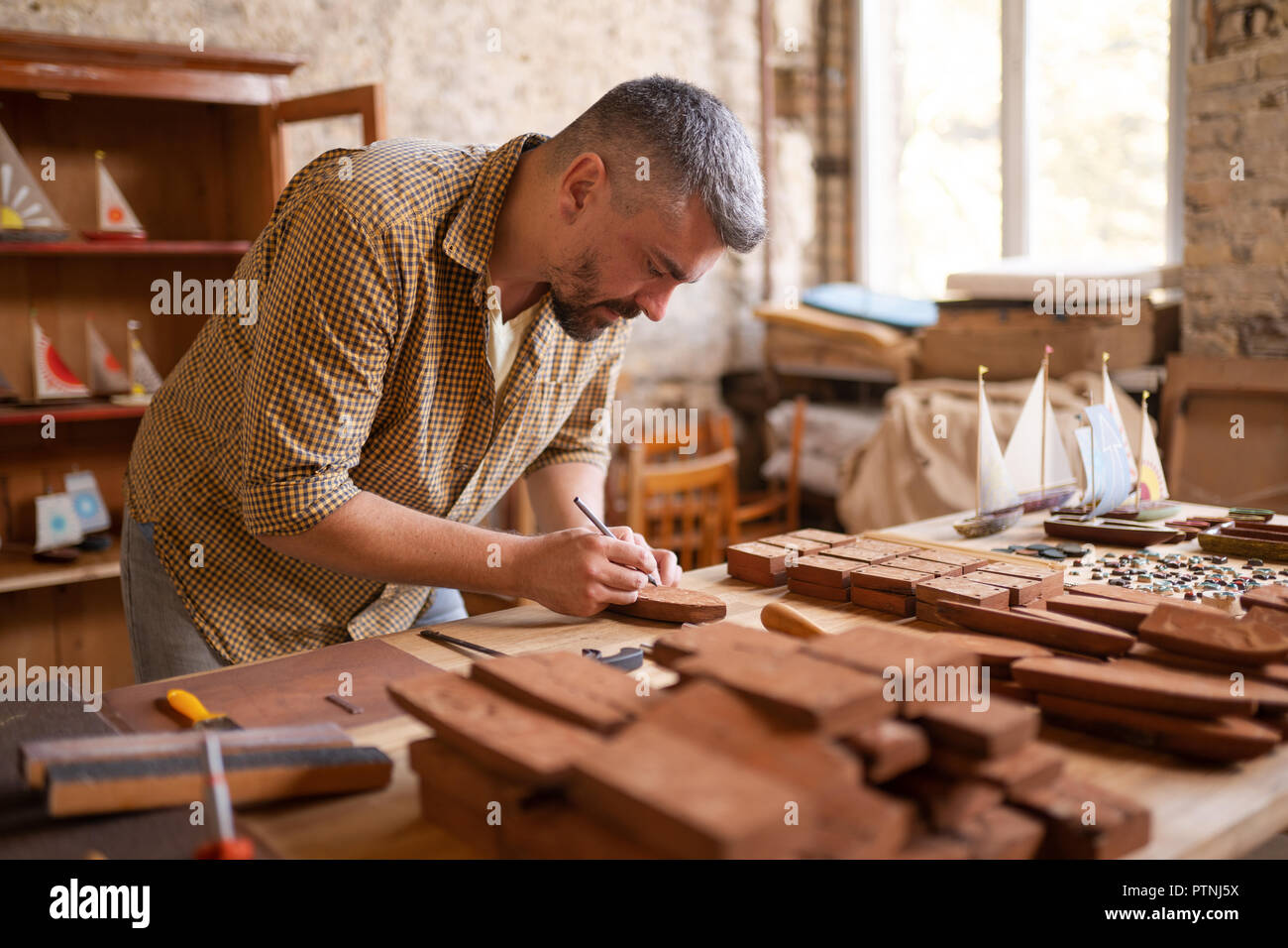 Wood carpenter at work in his workshop Stock Photo - Alamy