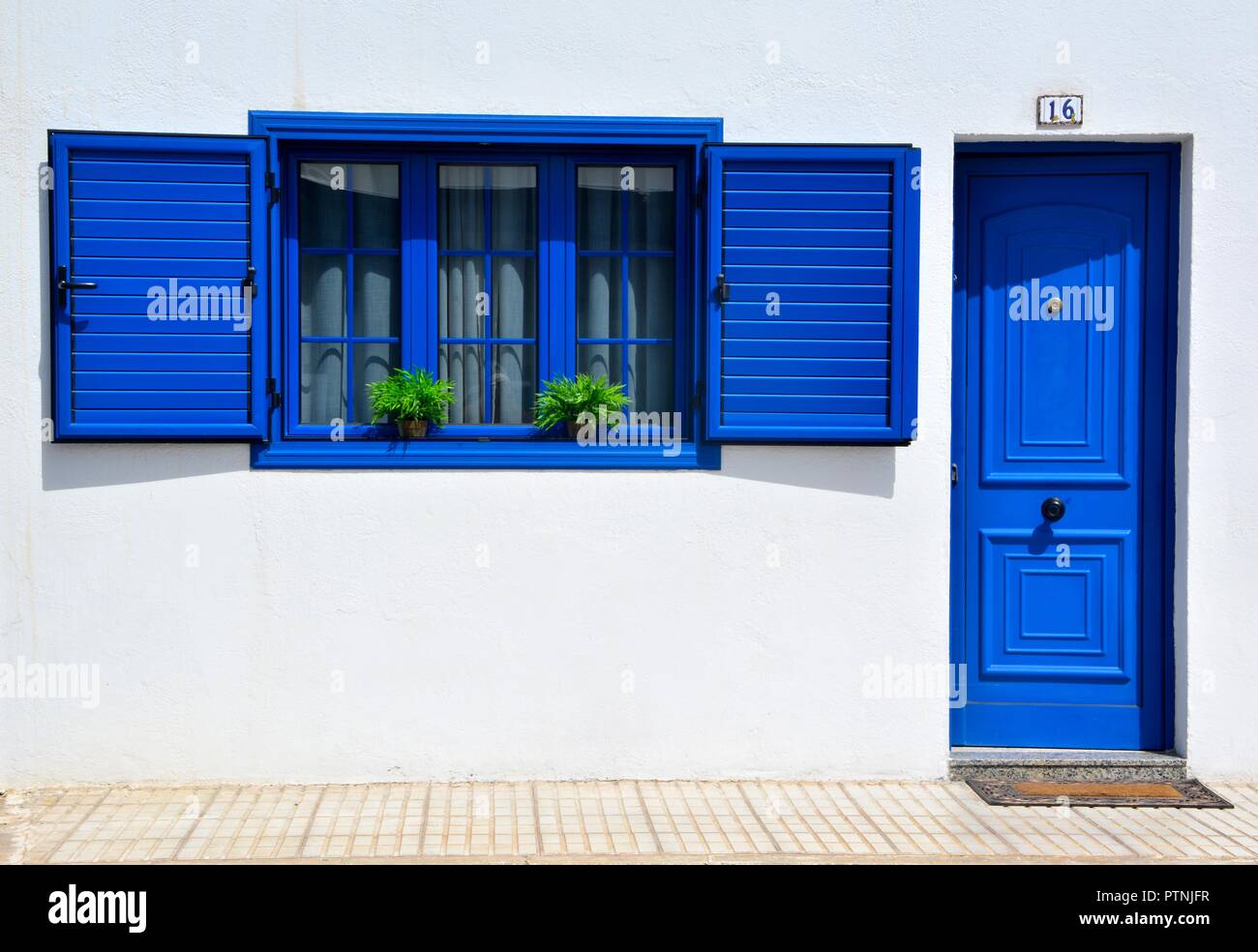 Blue window frames hi-res stock photography and images - Alamy