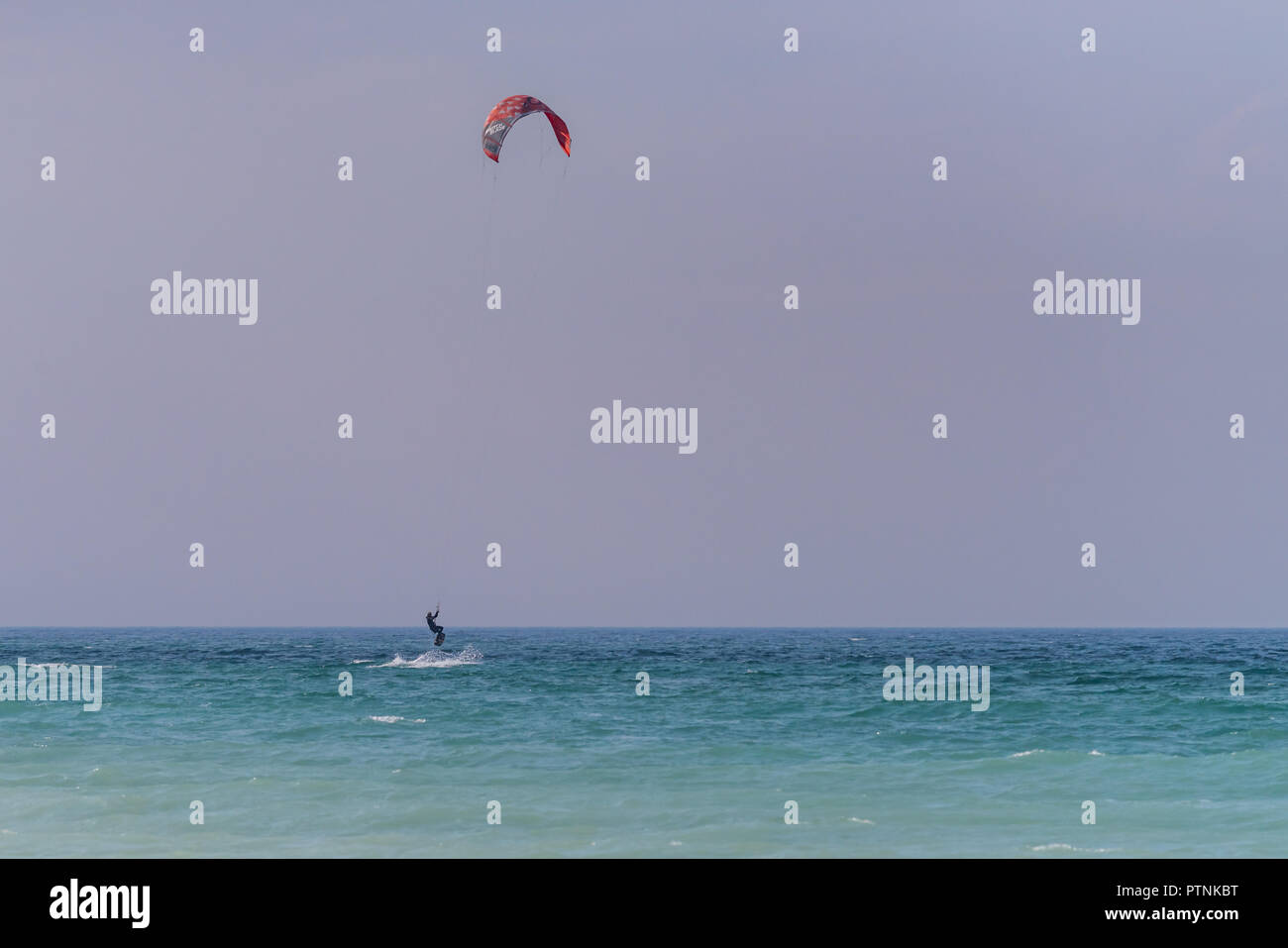 Kite surfer skimming surface of lake Stock Photo - Alamy
