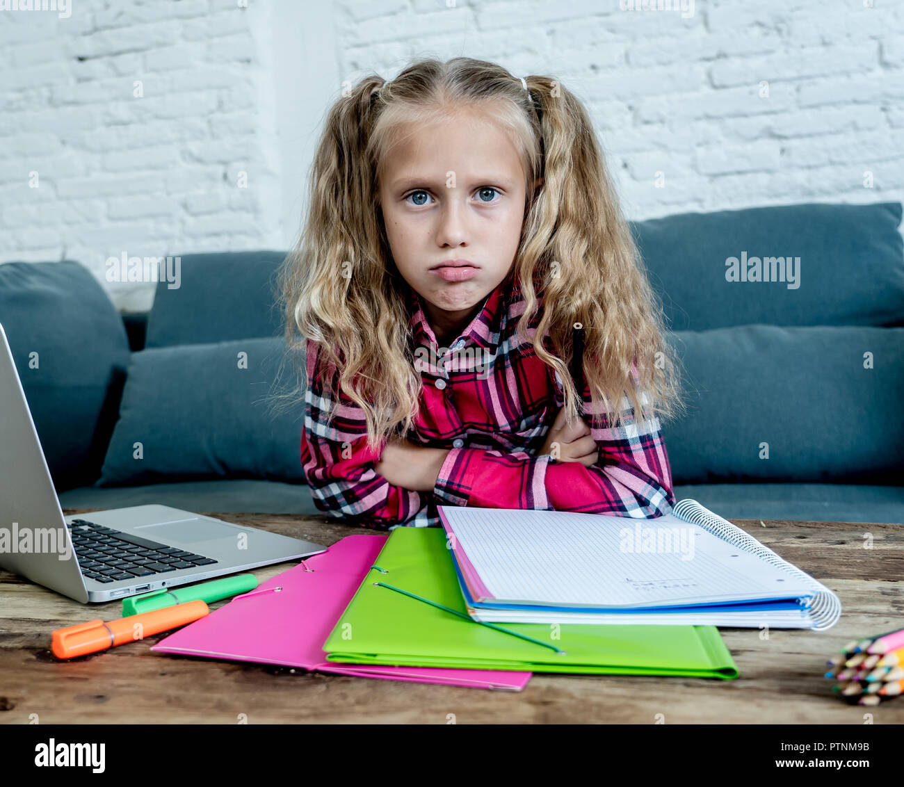 Cute sweet sad and overwhelmed blonde hair primary school girl looking ...