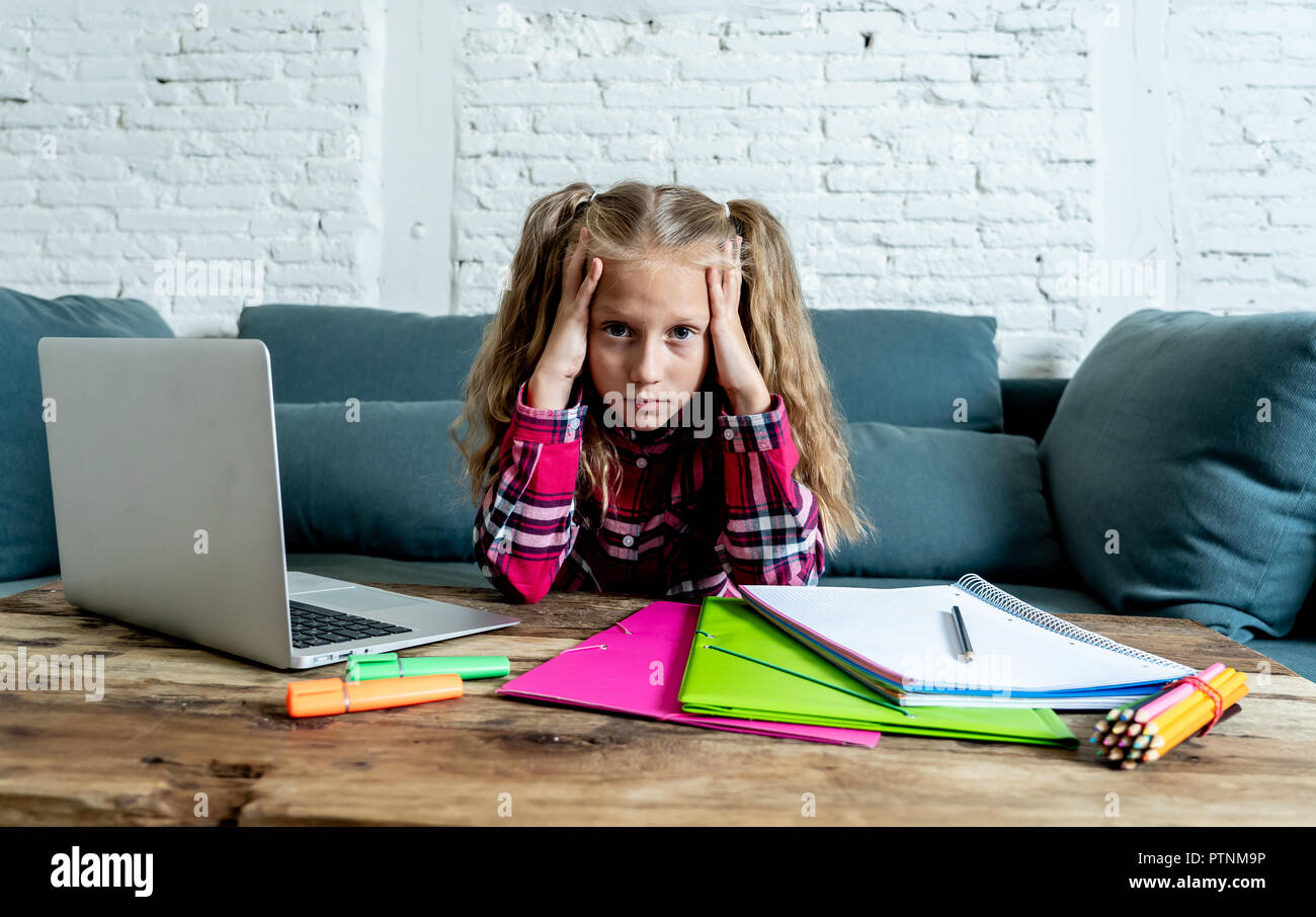 Cute elementary student feeling sad and confusing while doing difficult ...