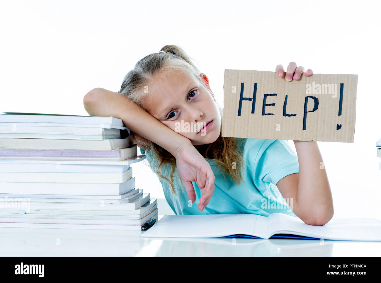 Frustrated little schoolgirl feeling a failure unable to concentrate in ...