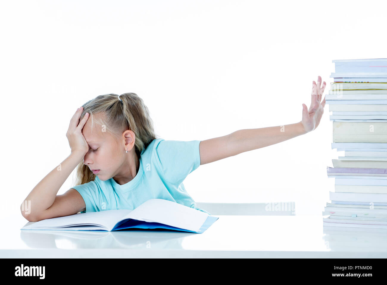 Beautiful school girl trying to study having too many homework that It ...