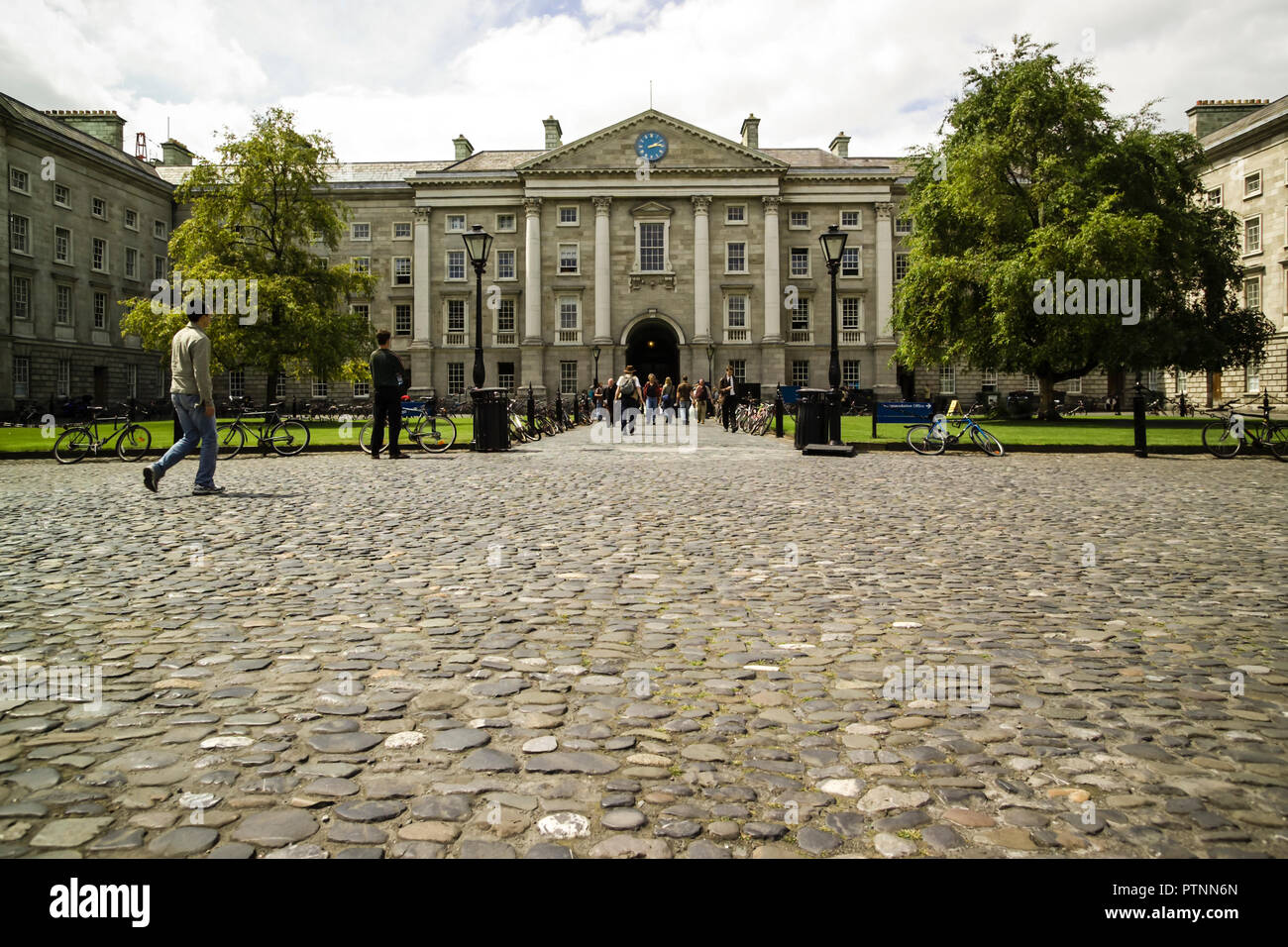 Regent House and cobbled square at front gate of Trinity College Dublin ...