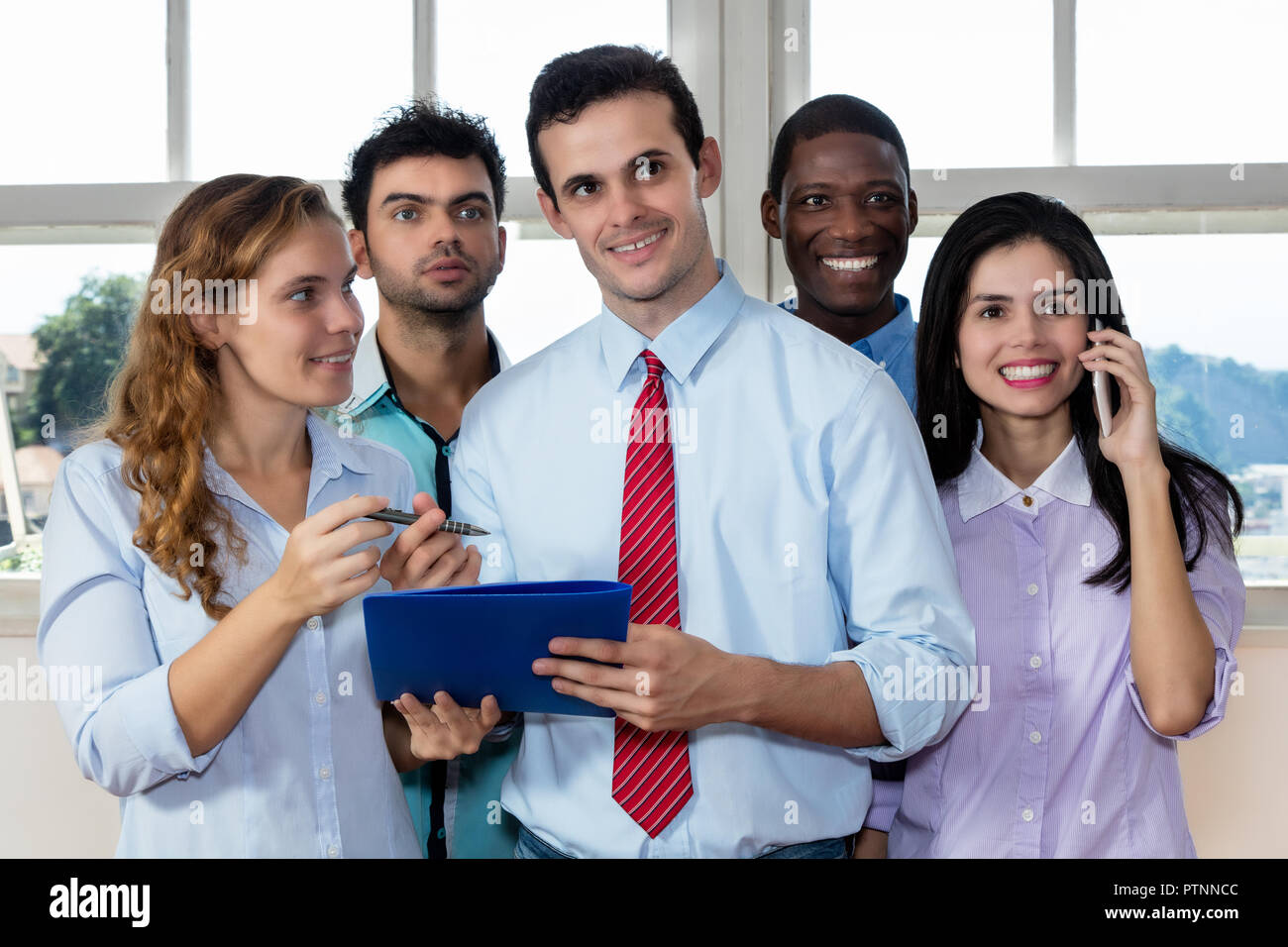 Happy smiling international people work hi-res stock photography and ...
