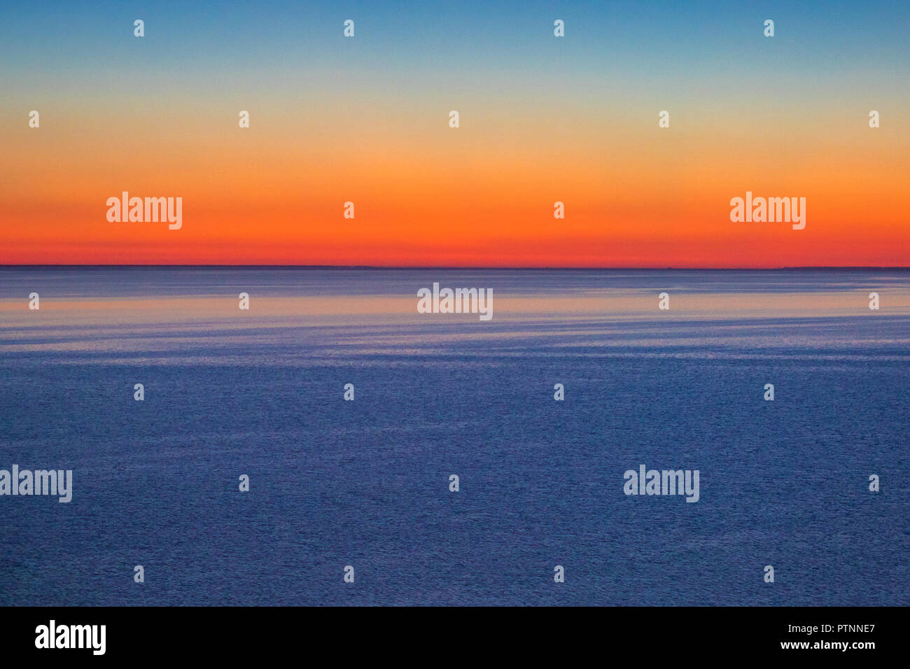 image red sunset sky on the water surface of the estuary Stock Photo ...