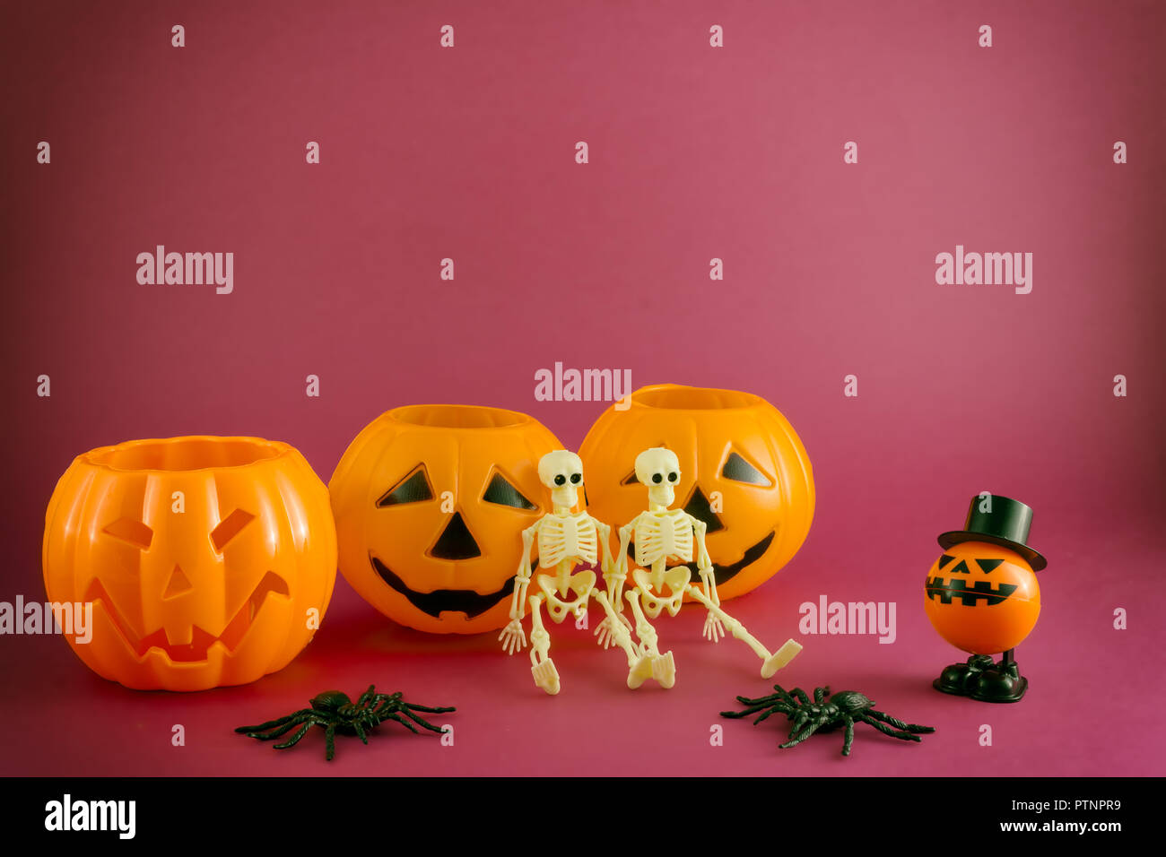 Isolated halloween toys, pumpkin, skeletons and bat Stock Photo - Alamy