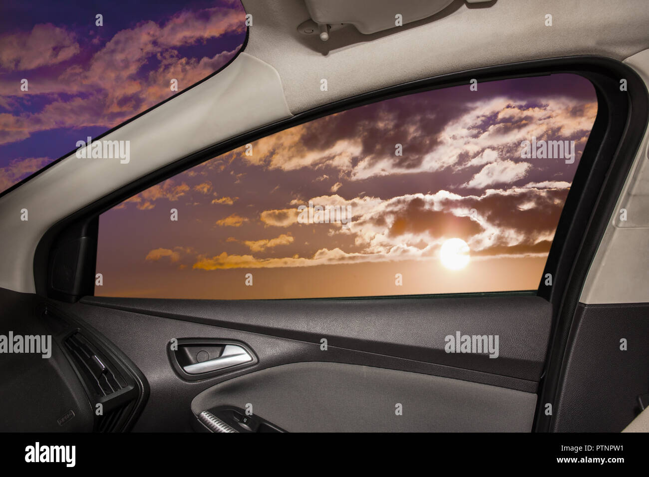 Heavenly landscape behind car window Stock Photo - Alamy