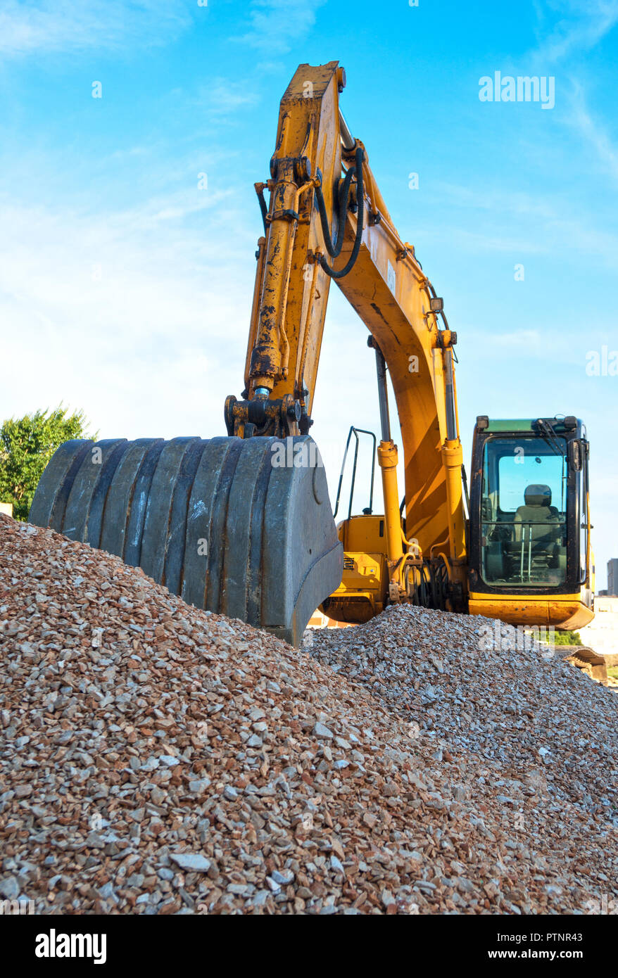 Excavator on construction site Stock Photo - Alamy