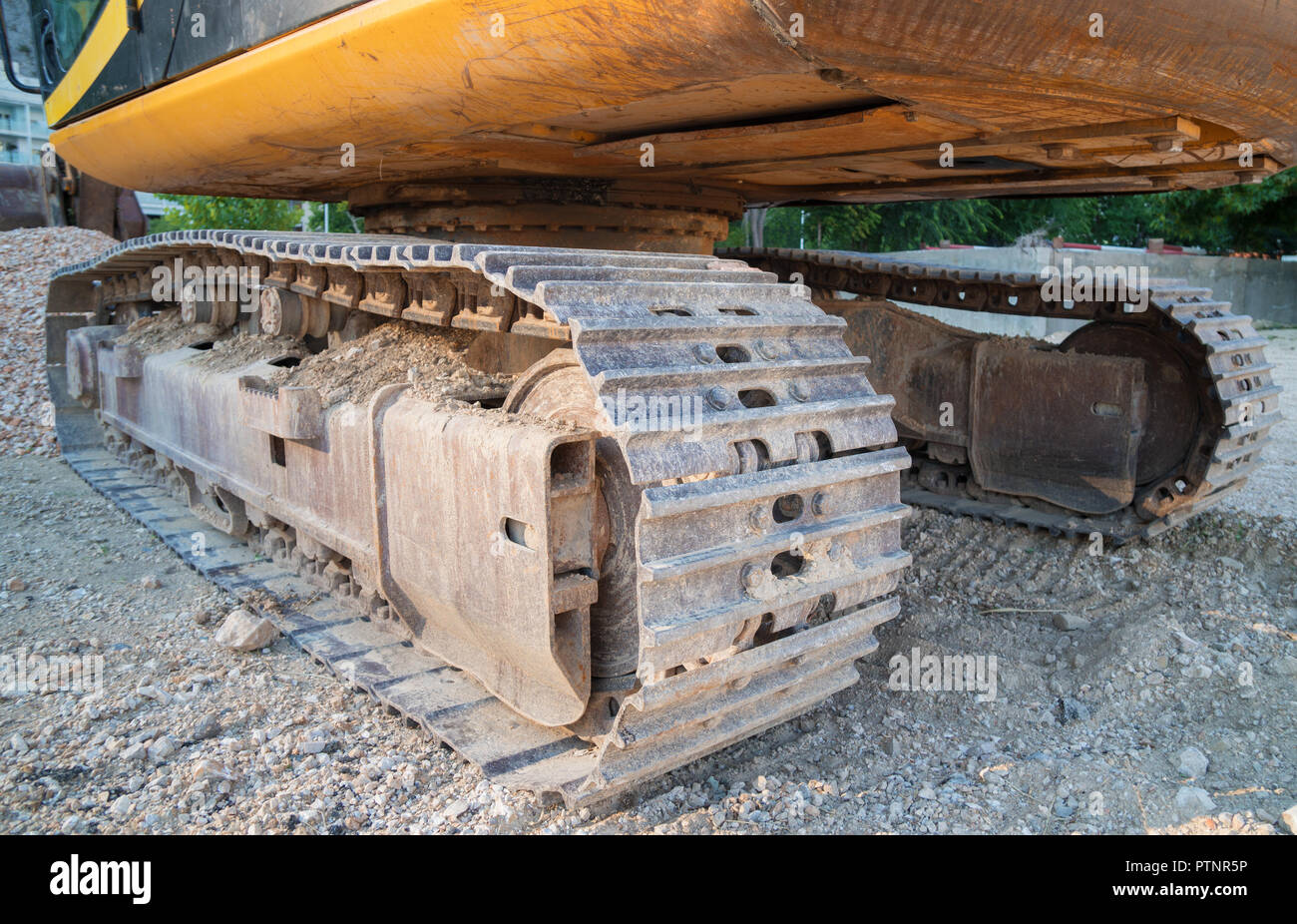 Excavator caterpillars on construction site Stock Photo - Alamy
