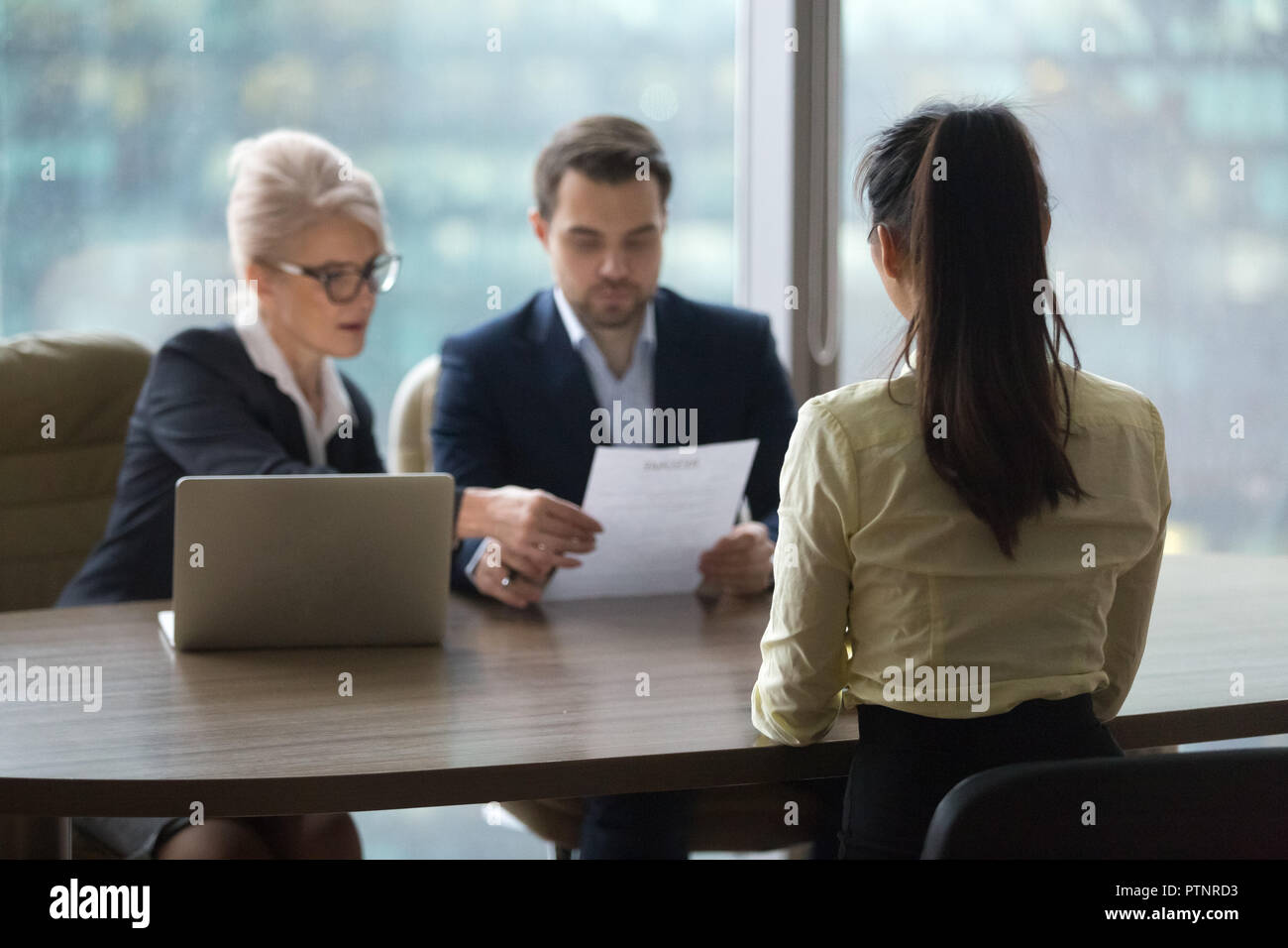 Female candidate interview with HR managers in office Stock Photo - Alamy