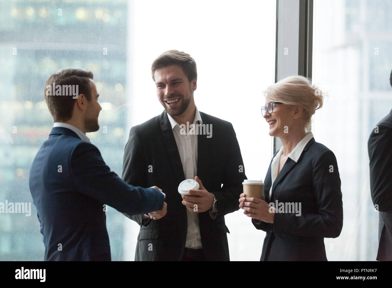 Standing smiling communication greeting hi-res stock photography and ...