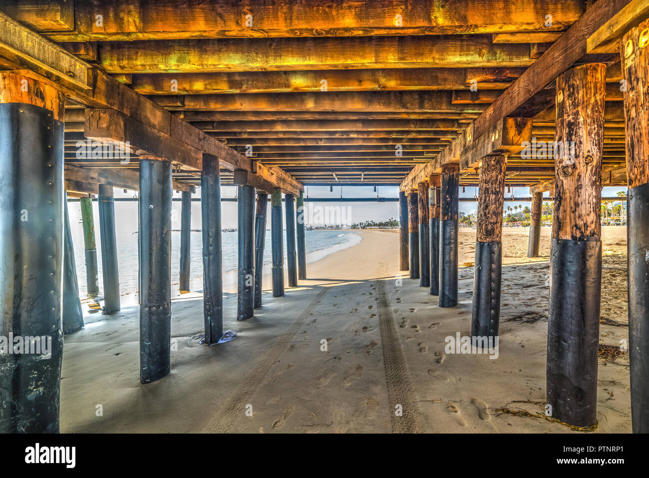 Wooden poles under a pier in Southern California, USA Stock Photo - Alamy