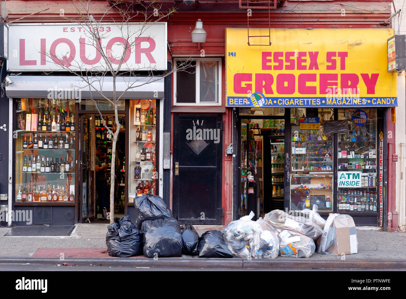 Liquor and Bodega storefronts on Essex St, Manhattan, New York City ...