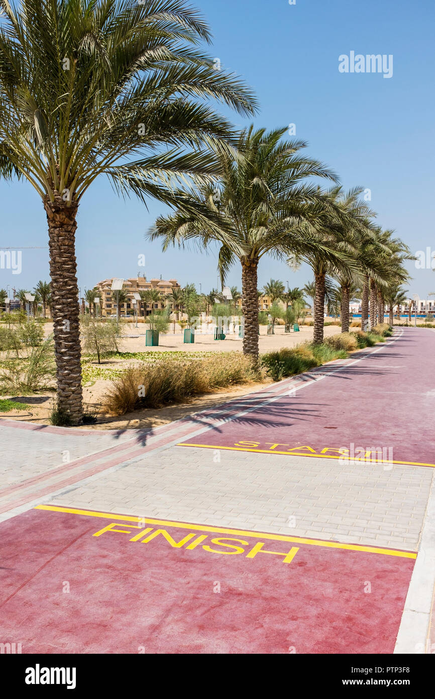 Running track in public park in Jumeirah Village Circle district of ...