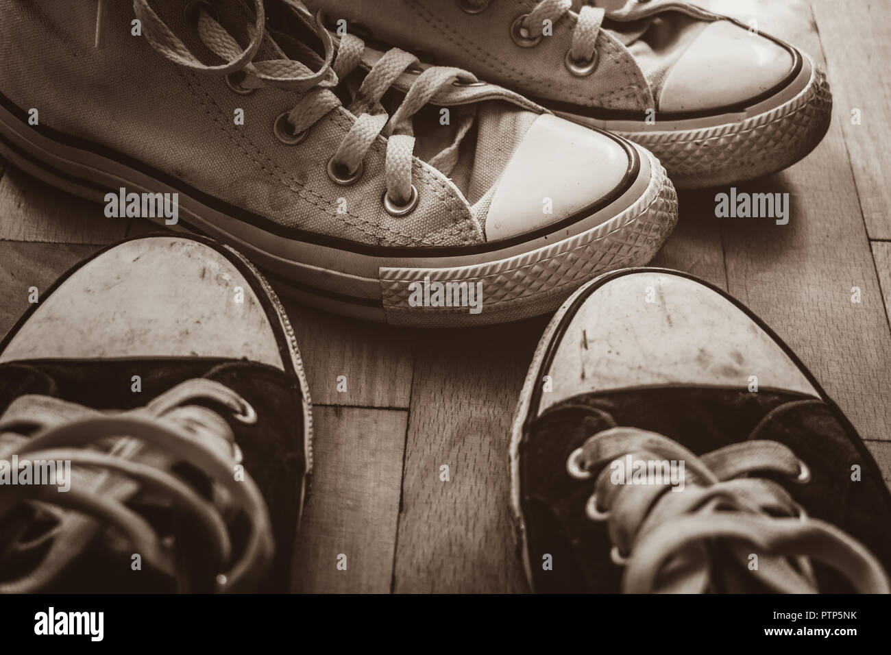 Old shoes on brown wood background Stock Photo - Alamy