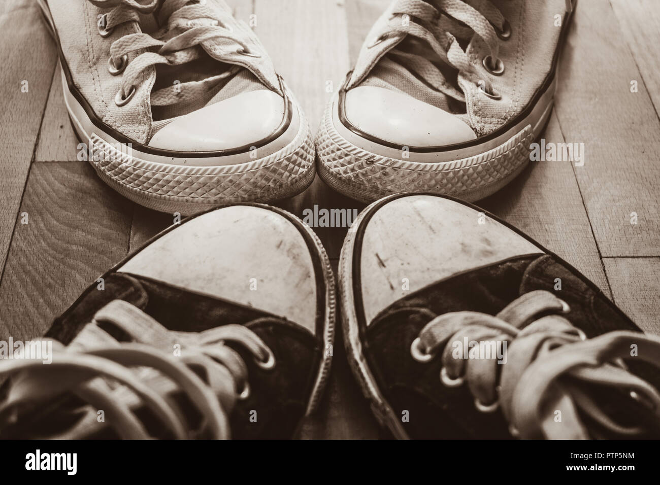 Old shoes on brown wood background Stock Photo - Alamy