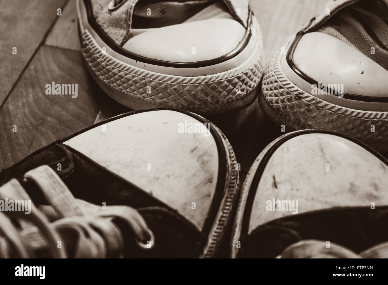 Old shoes on brown wood background Stock Photo - Alamy
