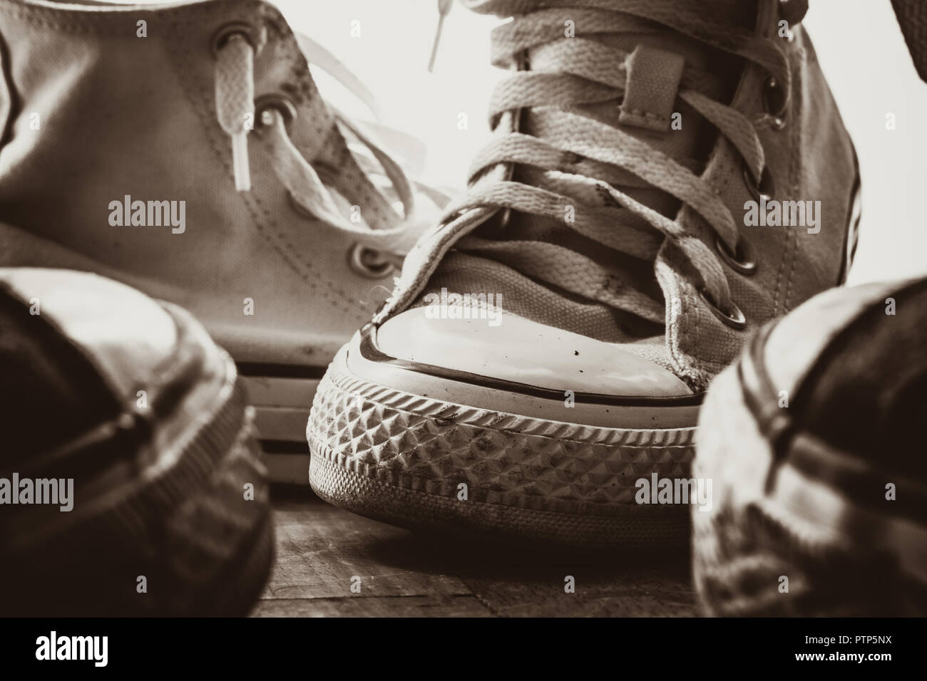 Old shoes on brown wood background Stock Photo - Alamy