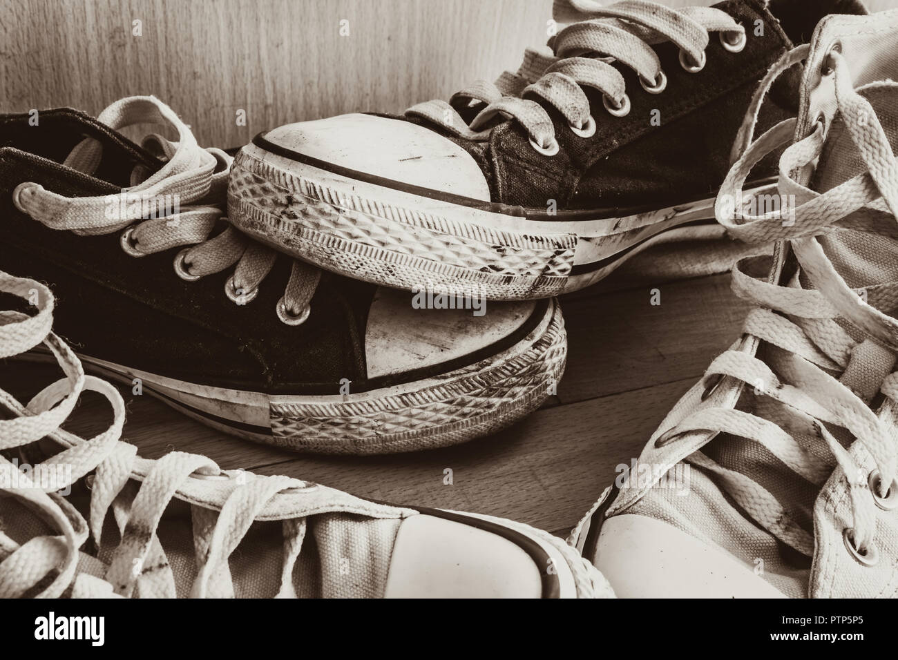 Old shoes on brown wood background Stock Photo - Alamy