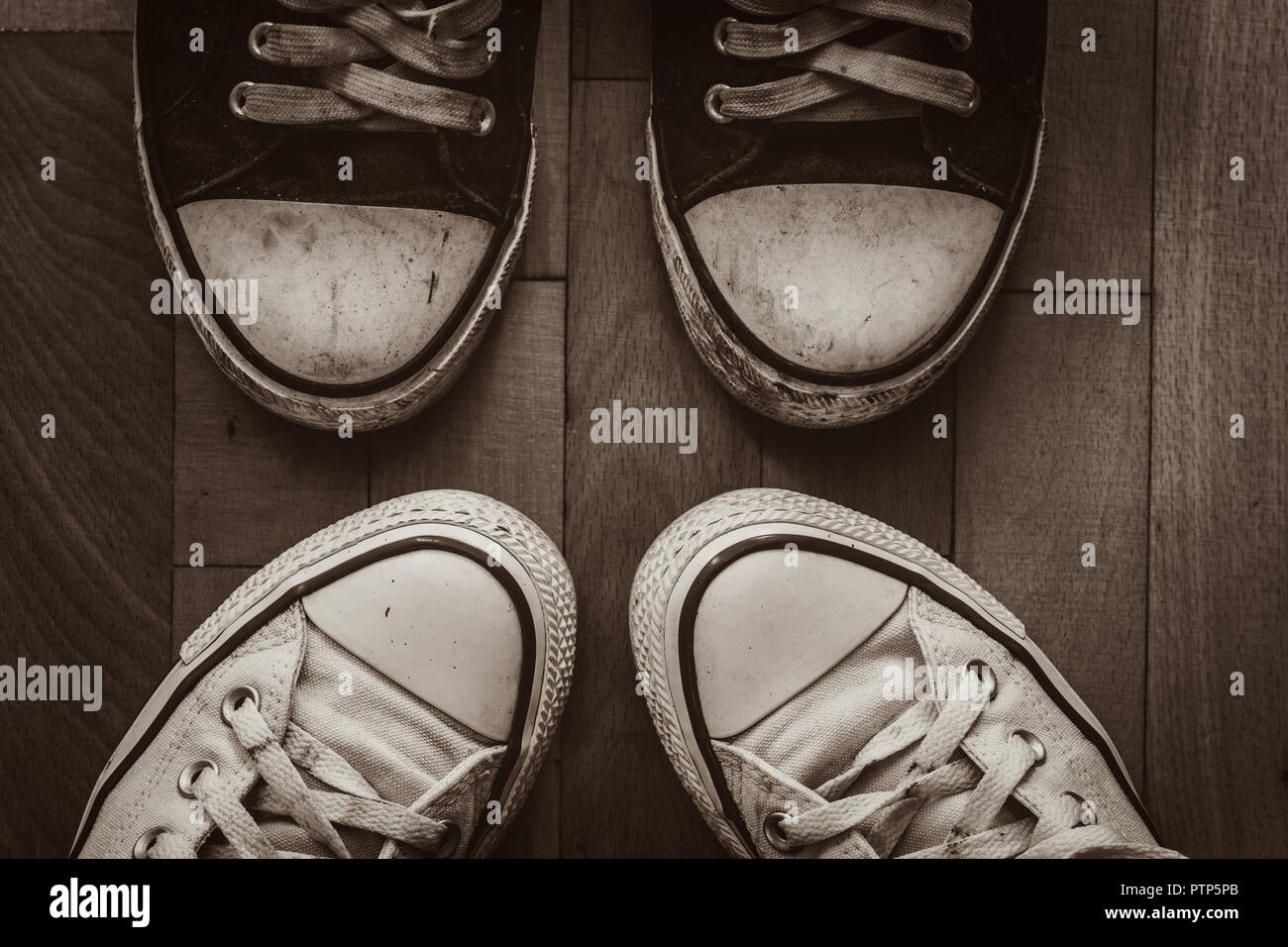 Old shoes on brown wood background Stock Photo - Alamy