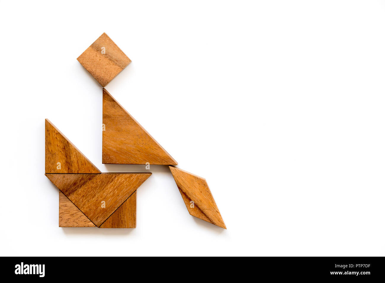 Wood tangram puzzle in man sitting on chair or toilet in restroom shape ...