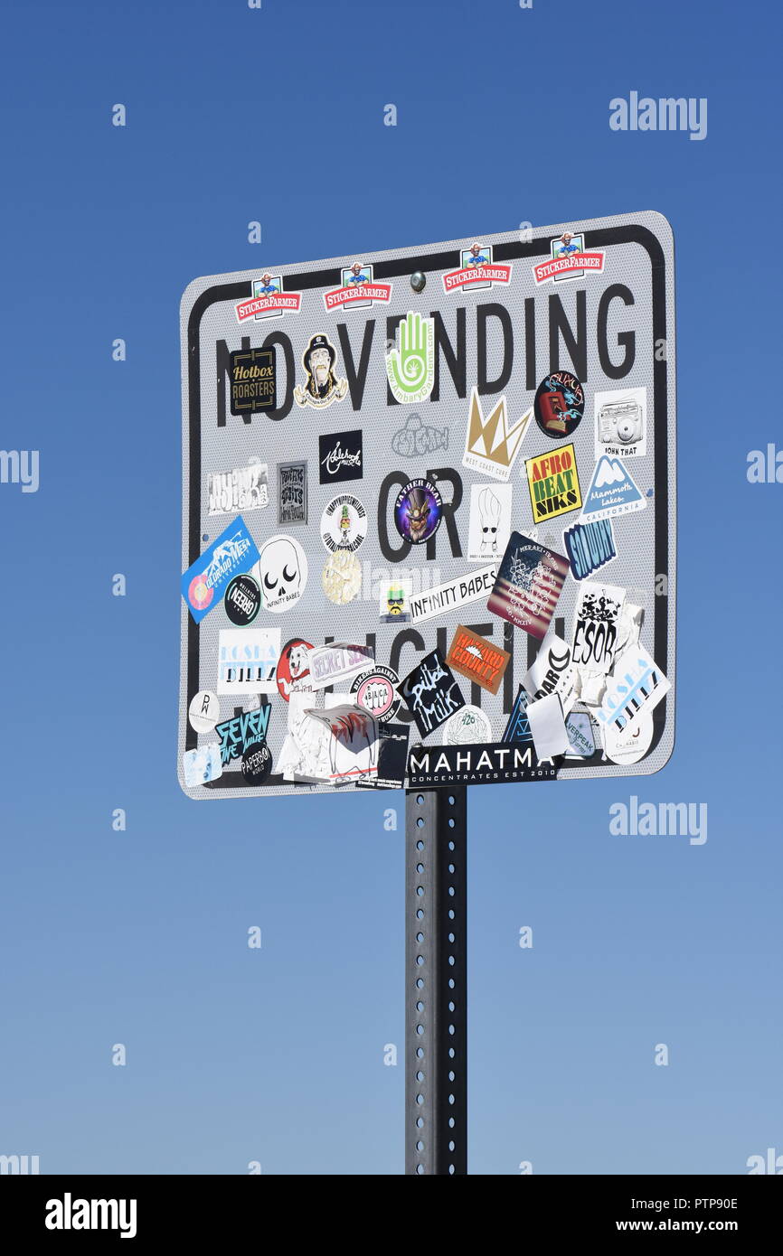 Defaced Street signs for handicapped and informational concepts with ...
