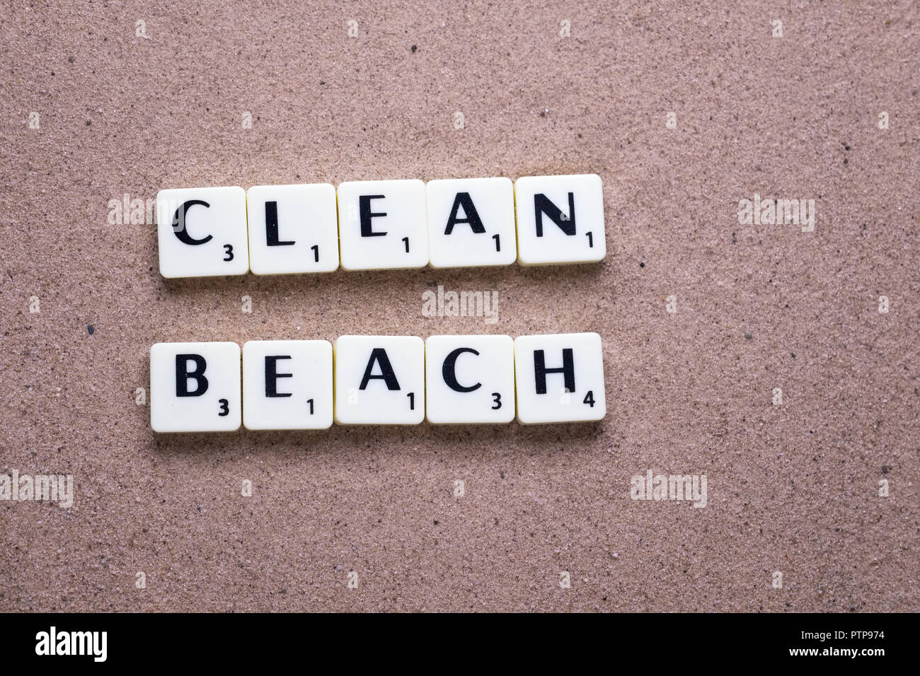 Clean beach letters on sand Stock Photo - Alamy