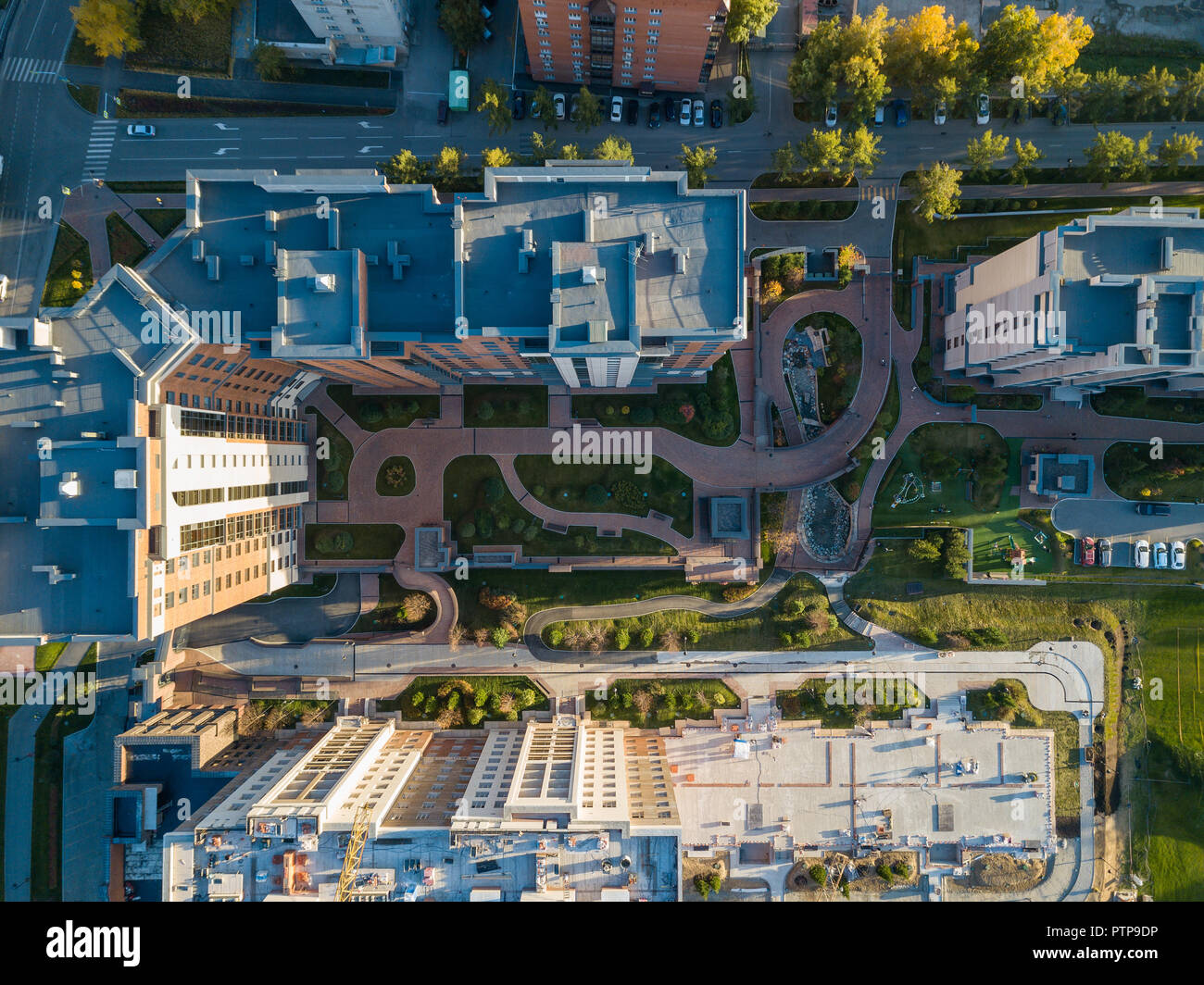 Aerial top view to the courtyard surrounded by tall houses with ...